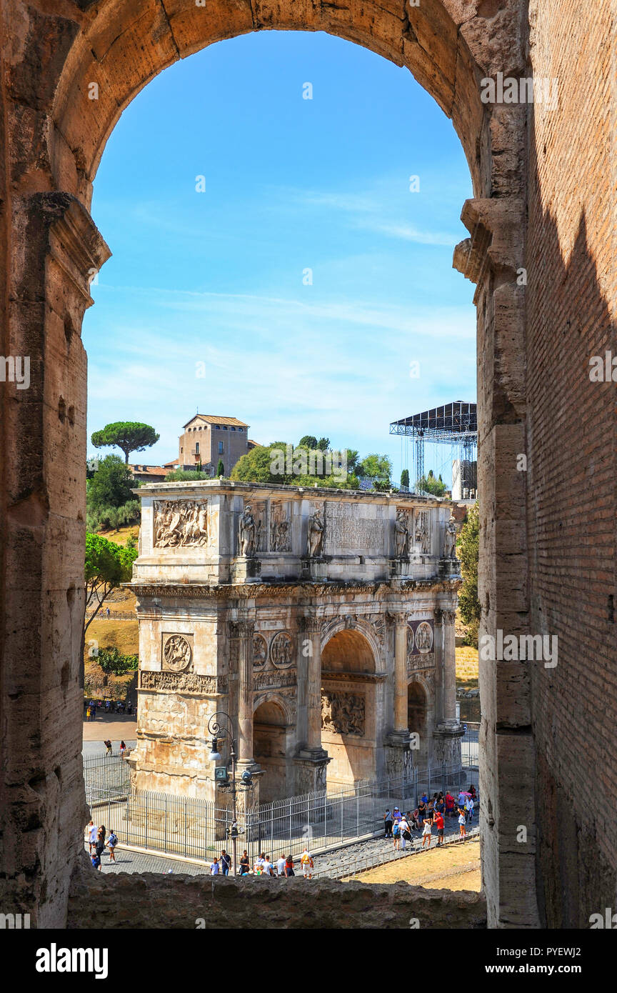 View on the Arch of Constantine through one of the Coliseum archs Stock ...