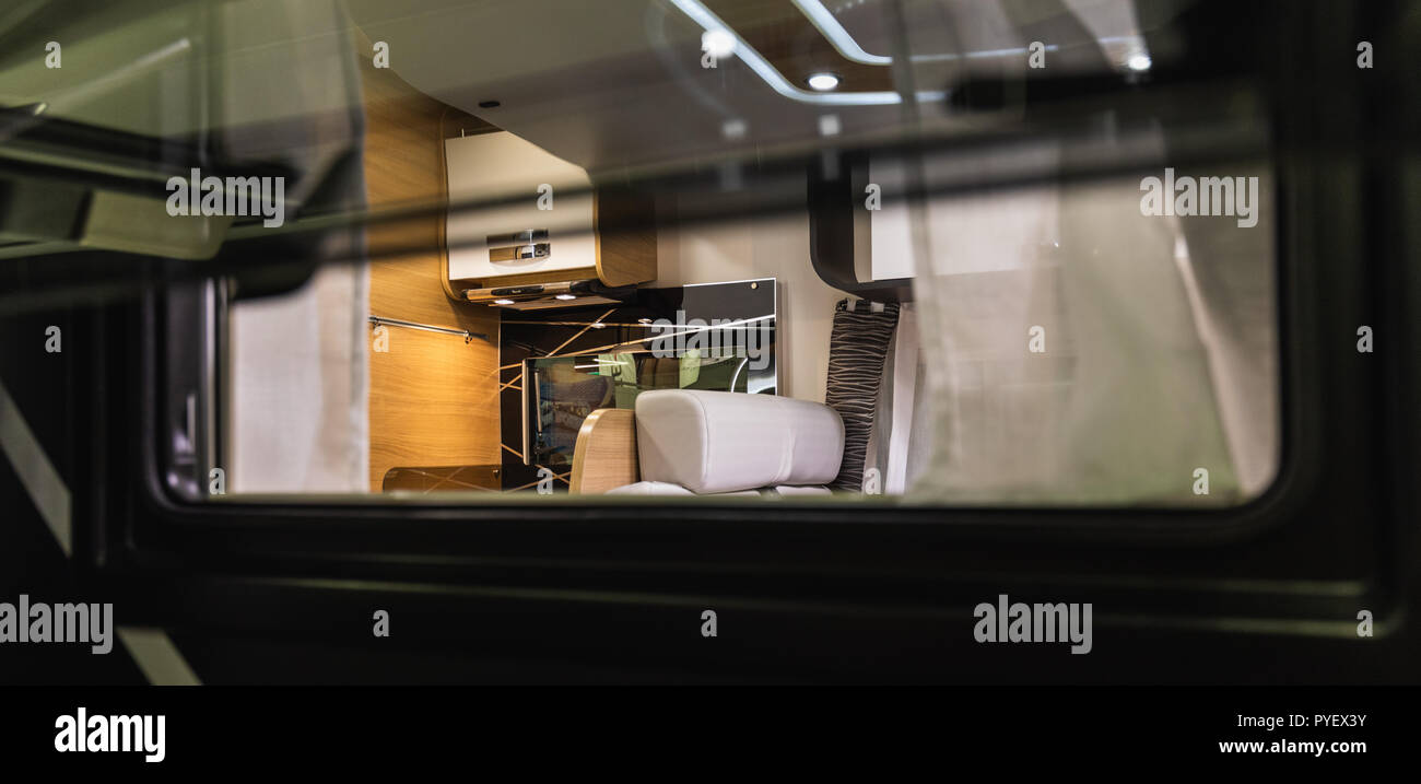outside standing and looking through a window of a caravan, switzerland ...