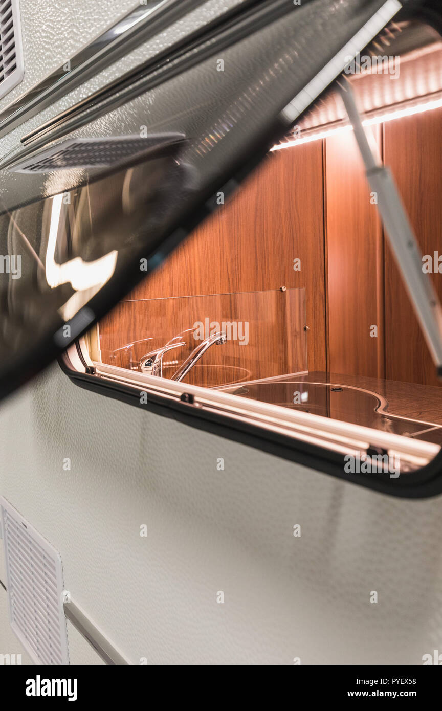 outside standing and looking through a window of a caravan, switzerland ...