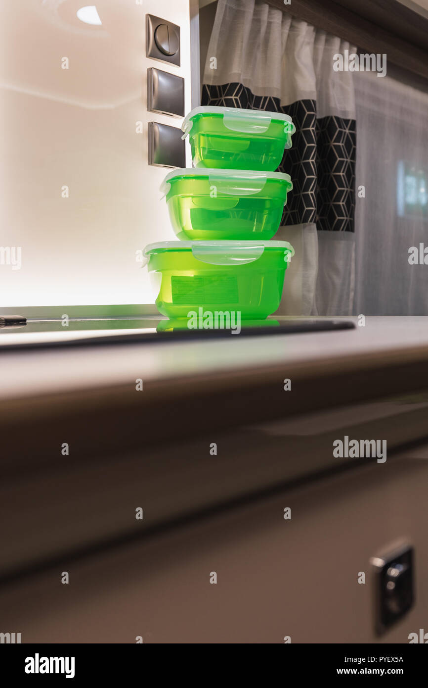 decorative tower of green food storage in the kitchen of a caravan ...