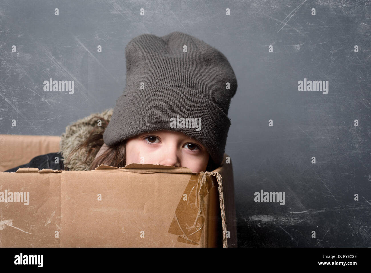 Sad girl in paper box Stock Photo - Alamy