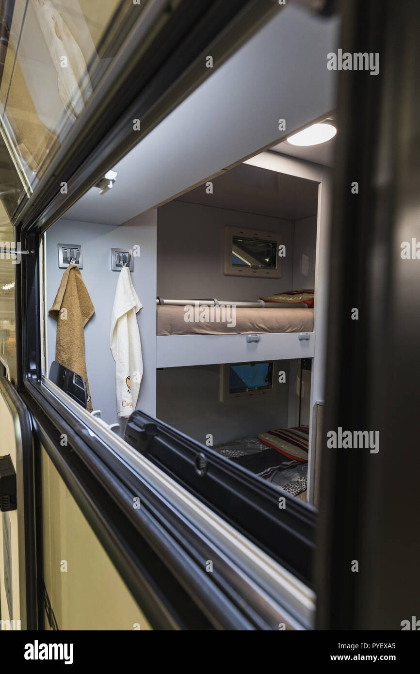 outside standing and looking through a window of a caravan, switzerland ...
