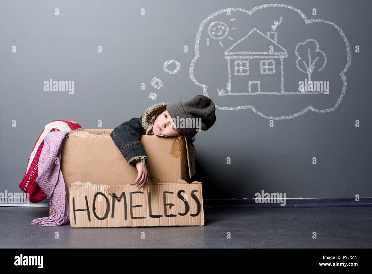 Sad homeless kid Stock Photo - Alamy