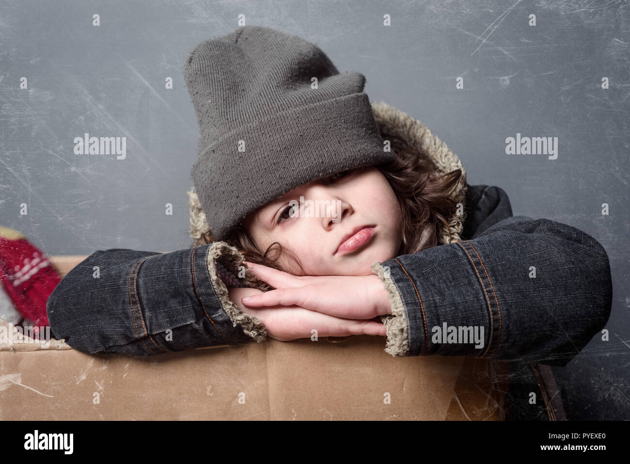 Tired girl wearing shabby clothes Stock Photo - Alamy