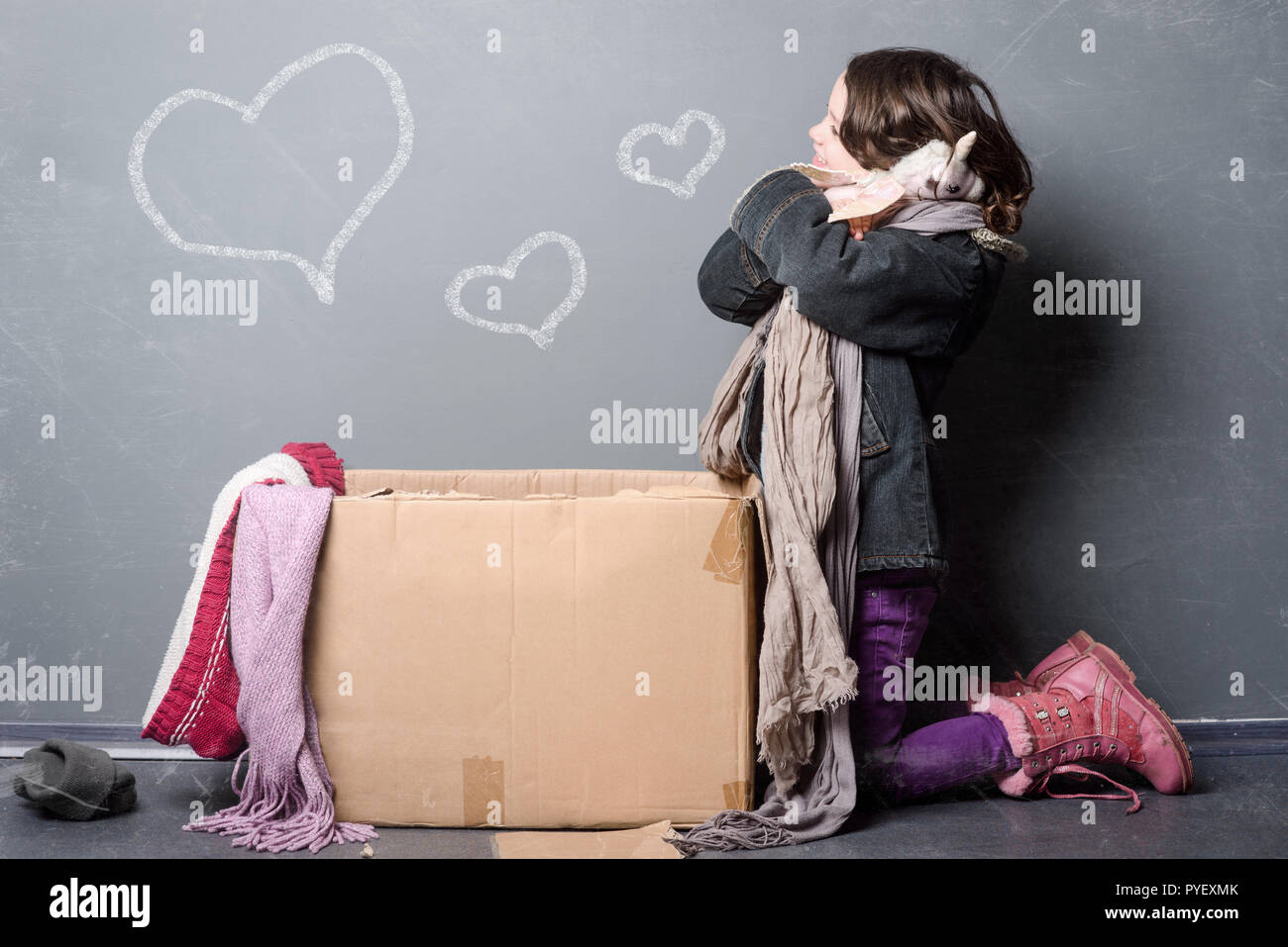 Little girl hugging toy Stock Photo - Alamy