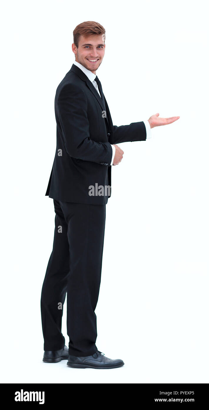 rear view.smiling businessman pointing forward. photo in full growth ...