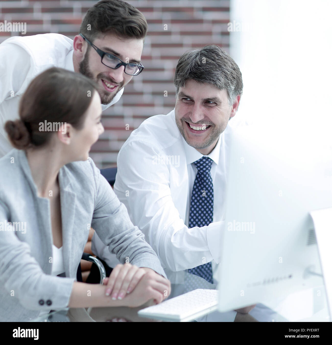 Friendly business team in the office Stock Photo - Alamy
