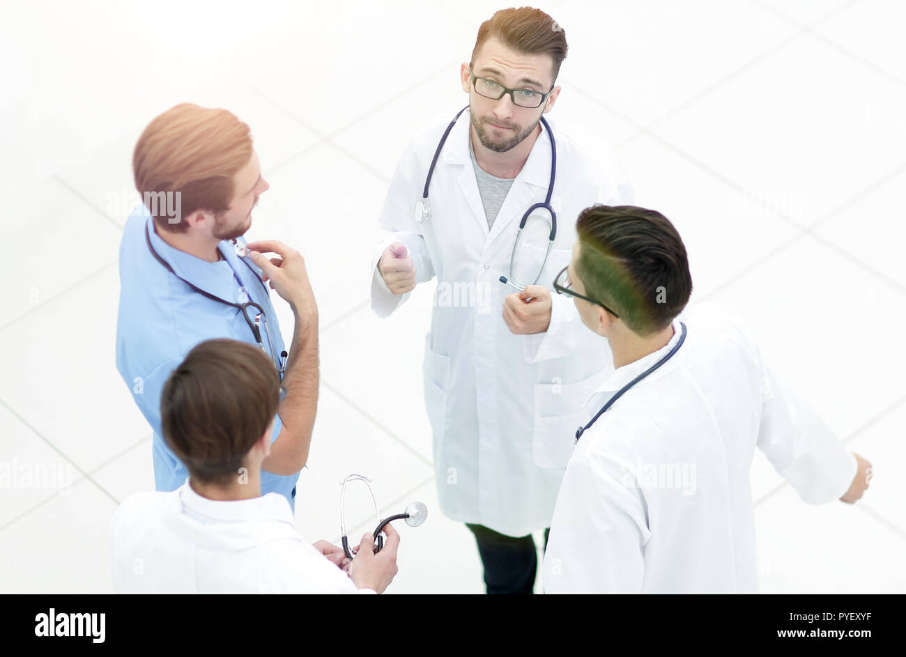 smiling group of doctors discussing Stock Photo - Alamy