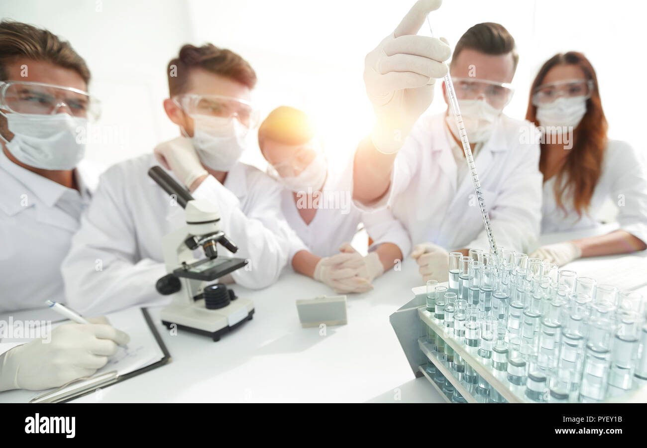 Scientists at chemical laboratory during work Stock Photo - Alamy