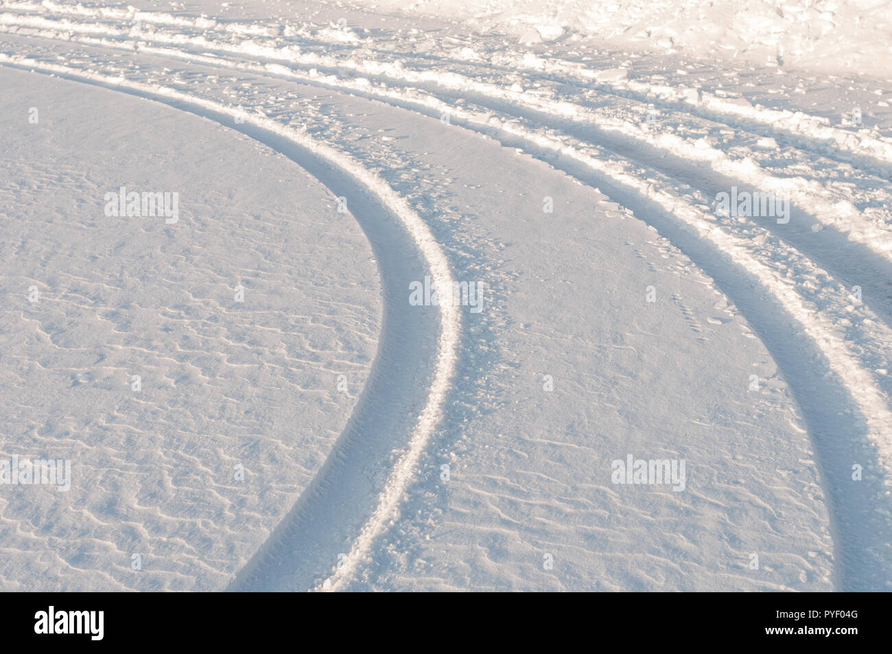 Car tire tracks in fresh snow Stock Photo - Alamy