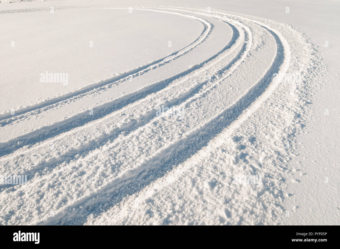 Tire tracks in snow Stock Photo - Alamy