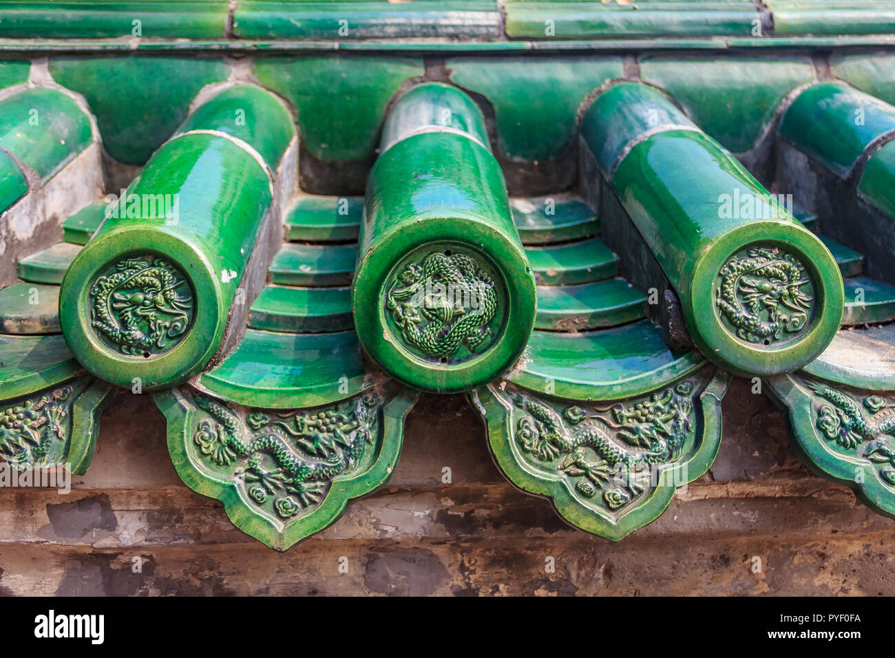 Old ornate roof of Chinese temple with beautiful green glazed tile ...