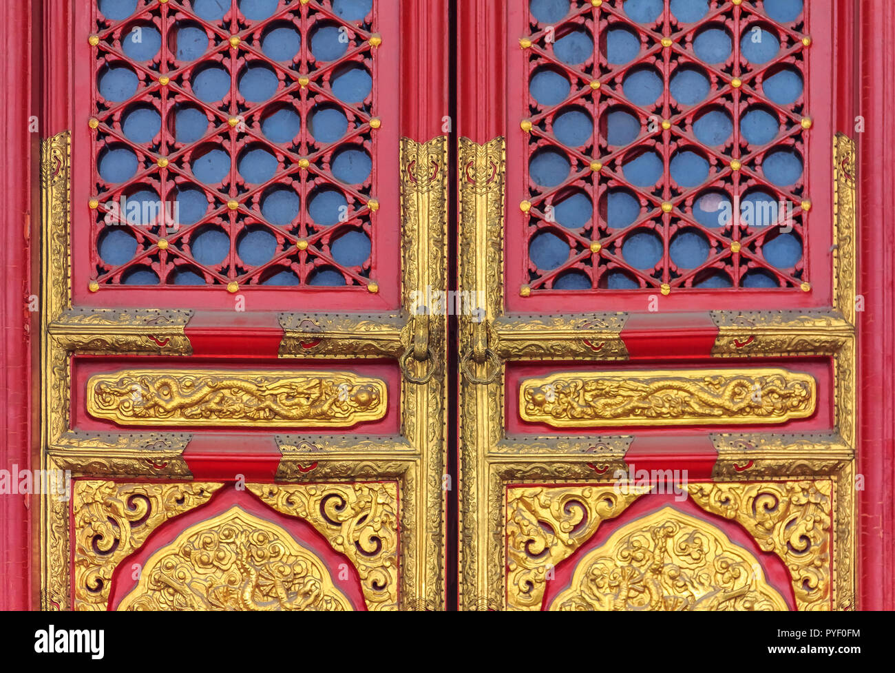 Ornate red wooden door with gold trim and traditional Chinese design at ...