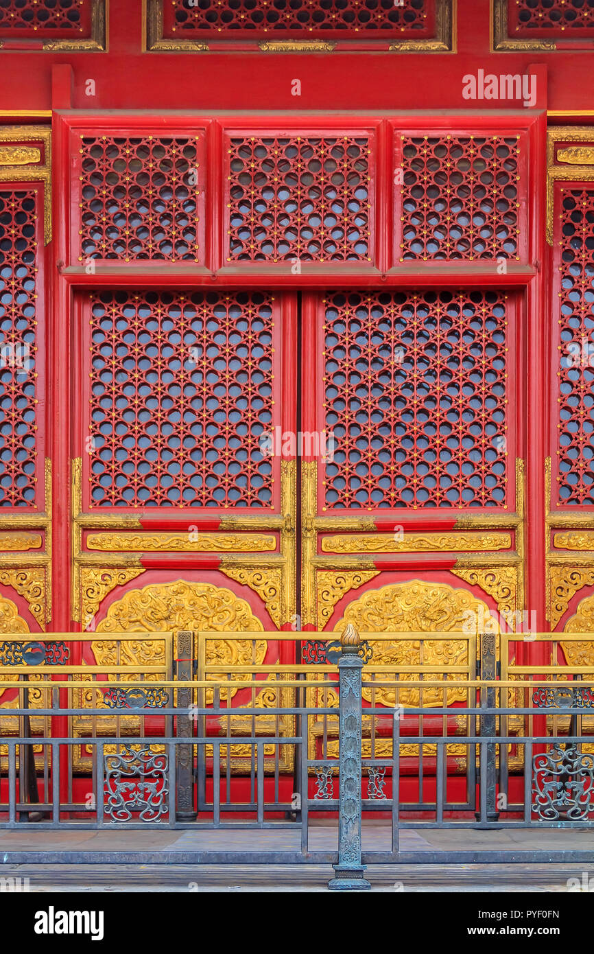 Ornate red wooden door with gold trim and traditional Chinese design at ...
