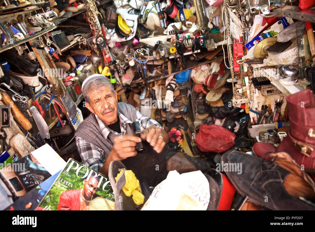 Shoe repair man hi-res stock photography and images - Alamy