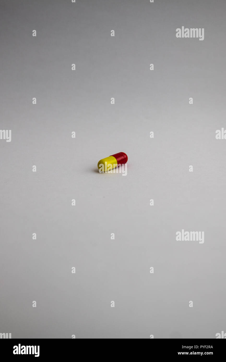 pill in red and yellow color on white background, medicine Stock Photo ...