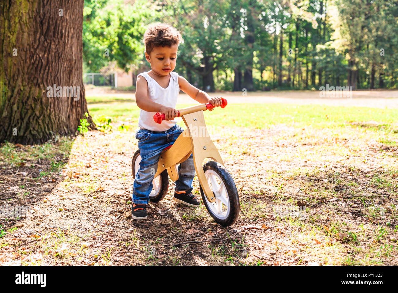 Wooden bicycle african boy hi-res stock photography and images - Alamy
