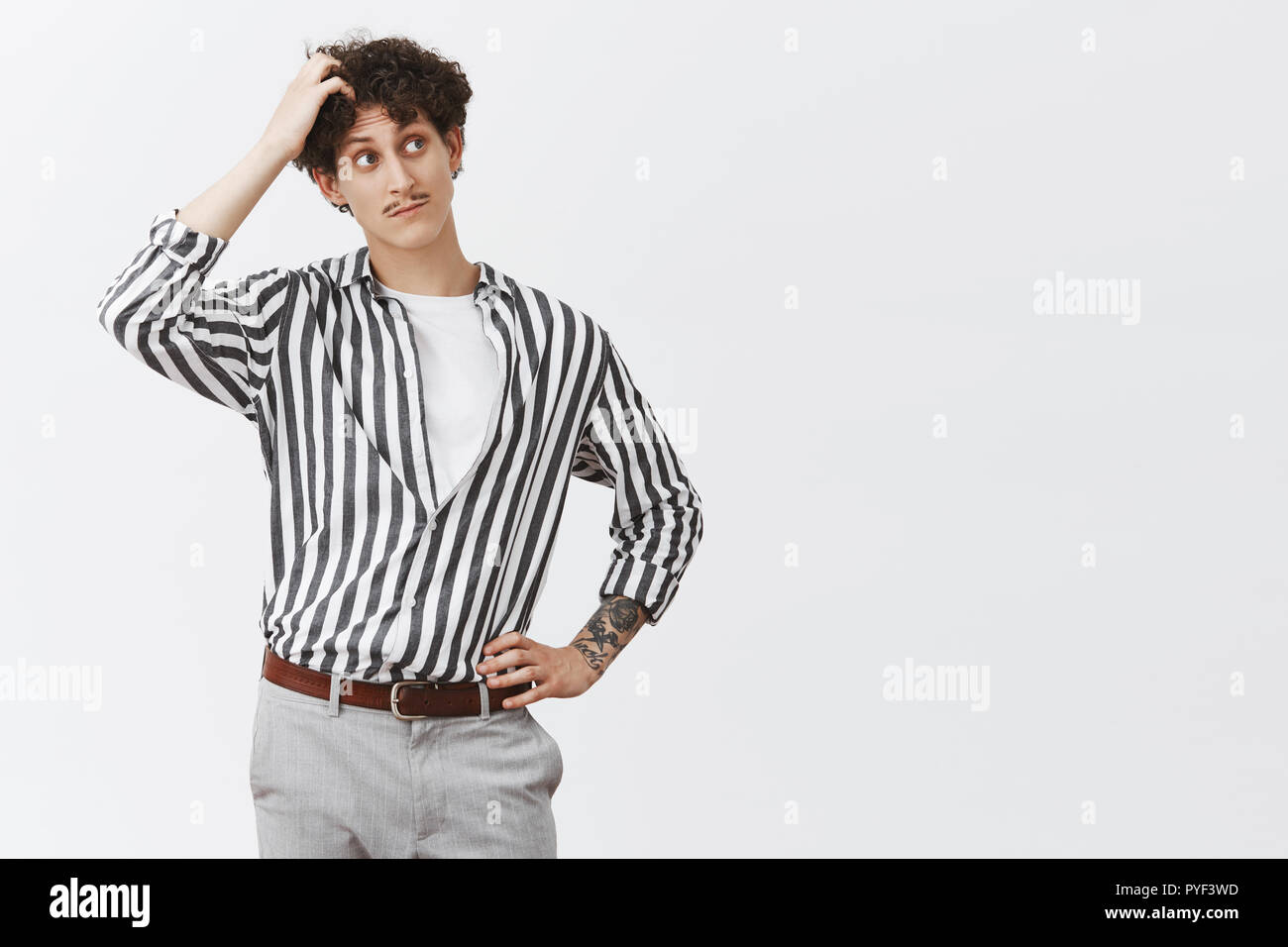 Unsure cute and trendy young jewish guy with curly hair moustache and ...