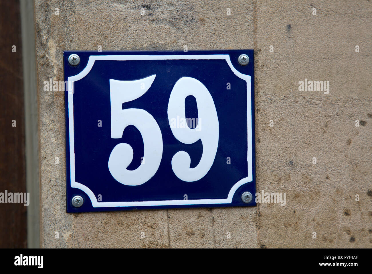 Fifty-Nine Number Sign on Stone Wall Stock Photo - Alamy