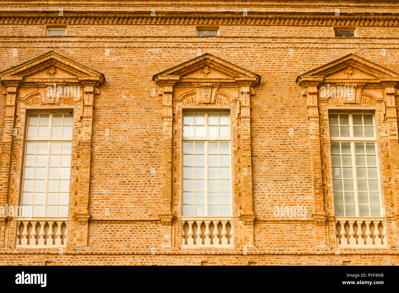 detail of a balcony of a building of 1600 with the typical brick facade ...