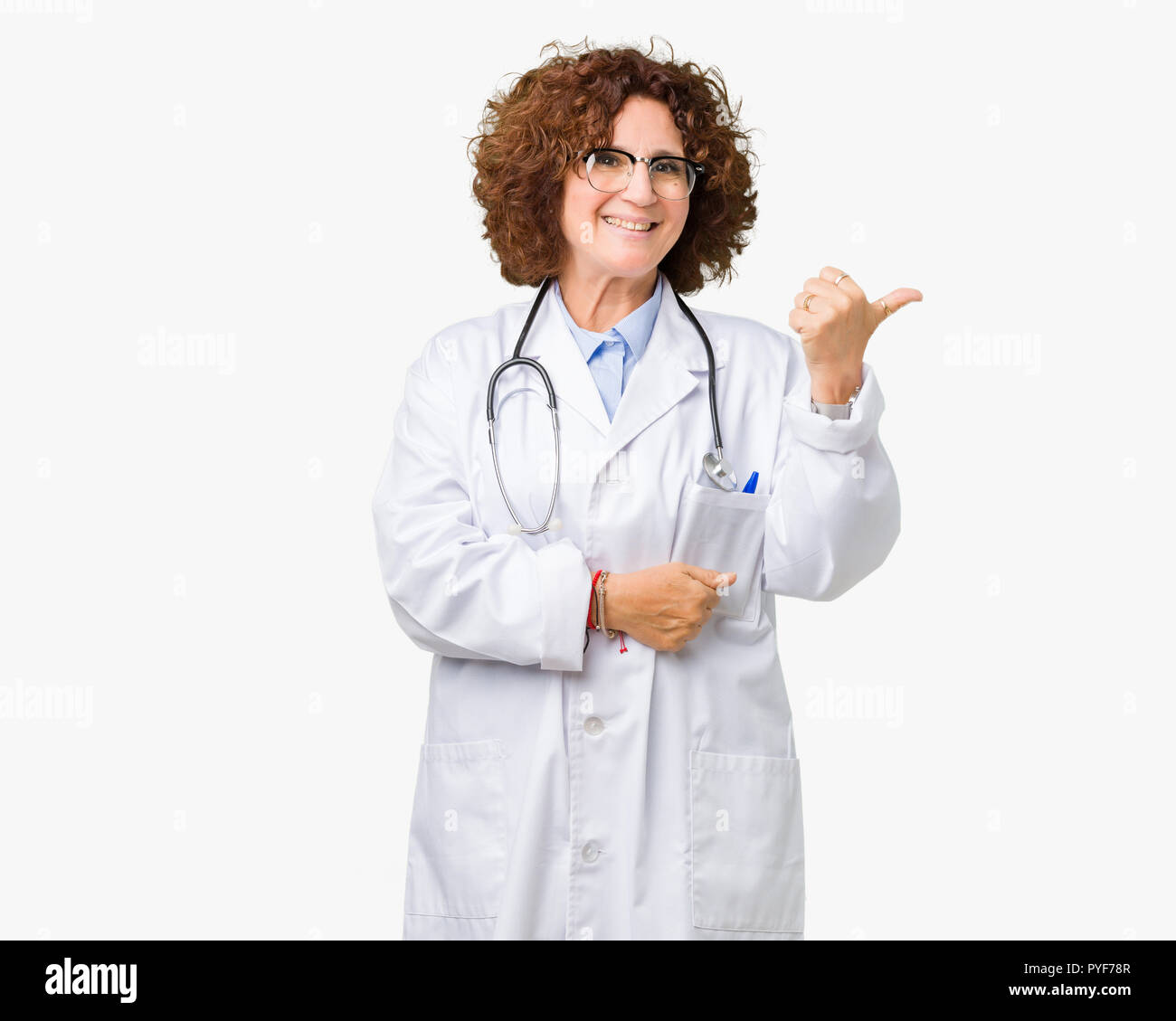 Middle ager senior doctor woman over isolated background smiling with ...