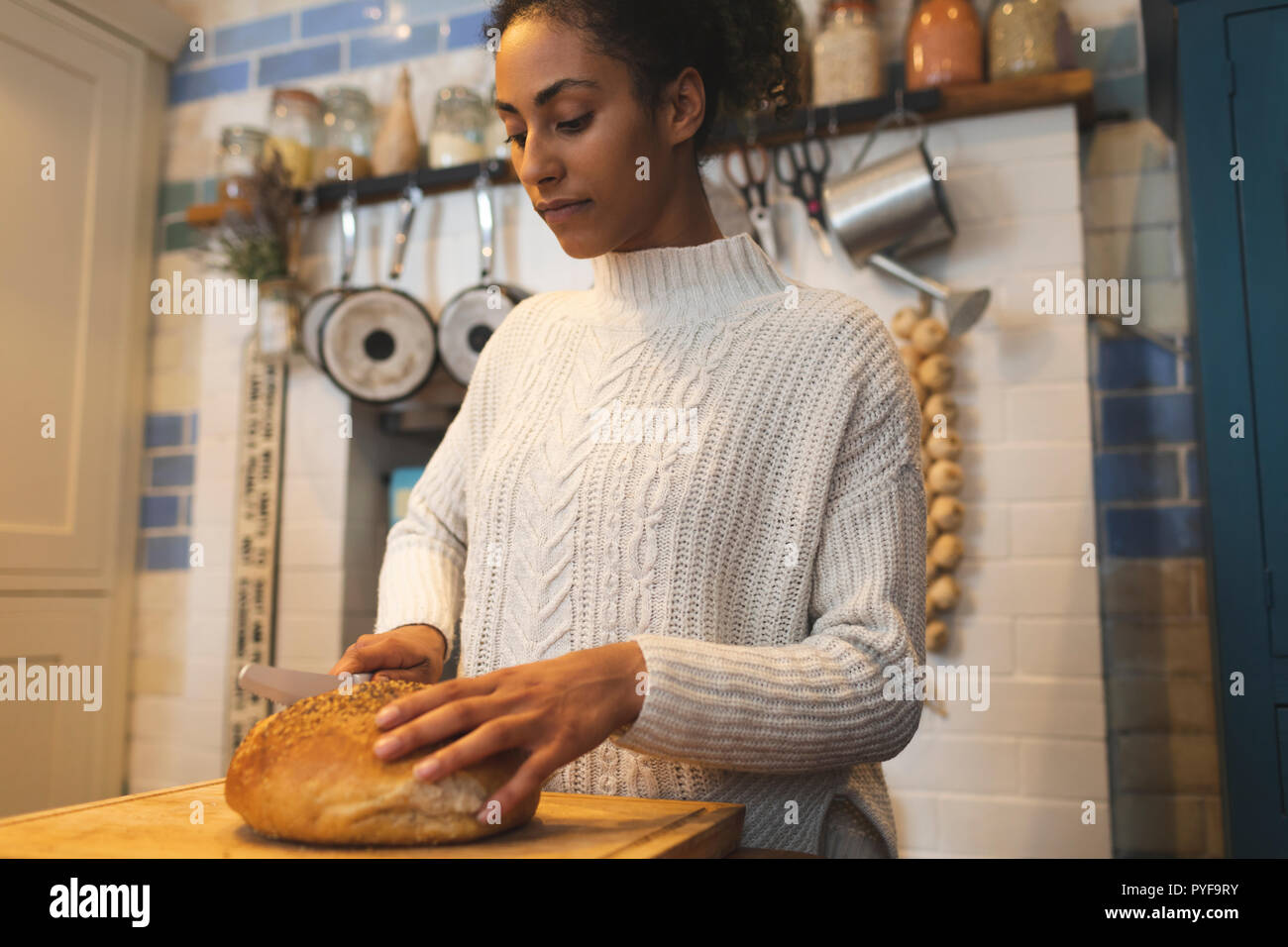 Woman holding loaf of bread hi-res stock photography and images - Alamy