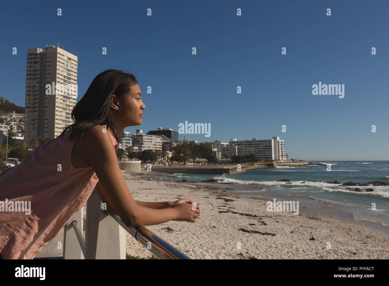 Woman leaning on railing hi-res stock photography and images - Alamy