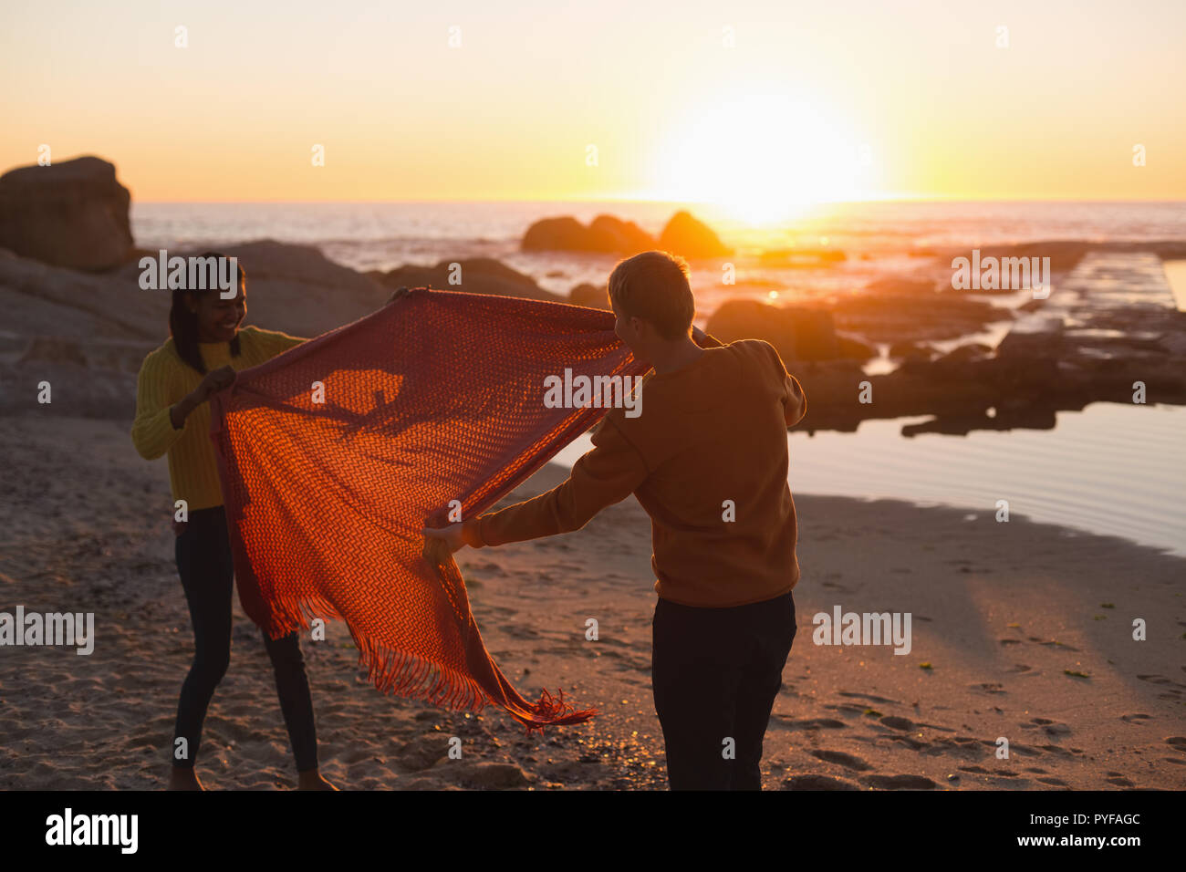 Happy adult caucasian couple having fun on the beach hi-res stock ...