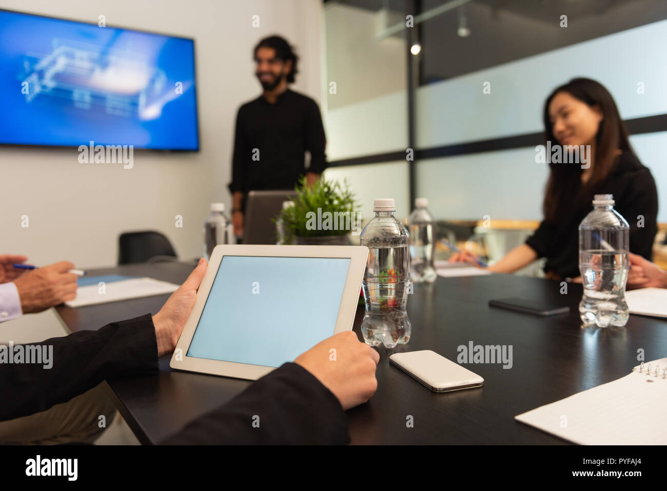 Female executive holding tablet hi-res stock photography and images - Alamy
