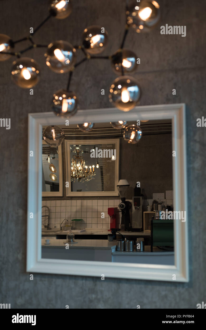 Reflection of kitchen in the mirror Stock Photo - Alamy