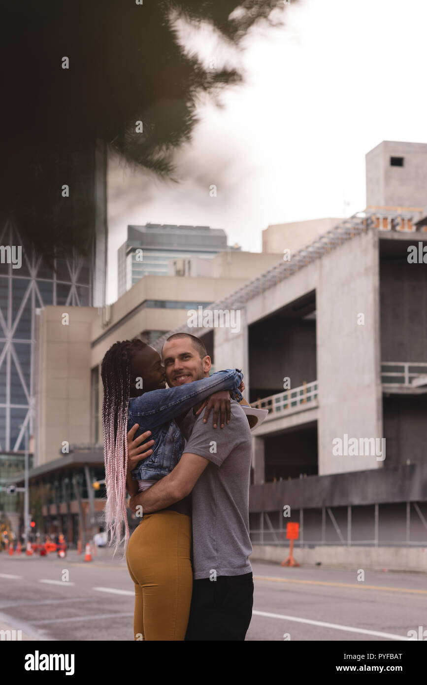 Romantic couple hugging on the street Stock Photo - Alamy