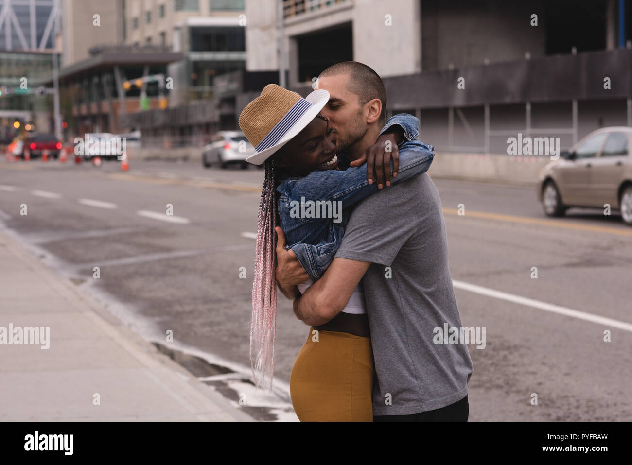 Romantic couple hugging on the street Stock Photo - Alamy
