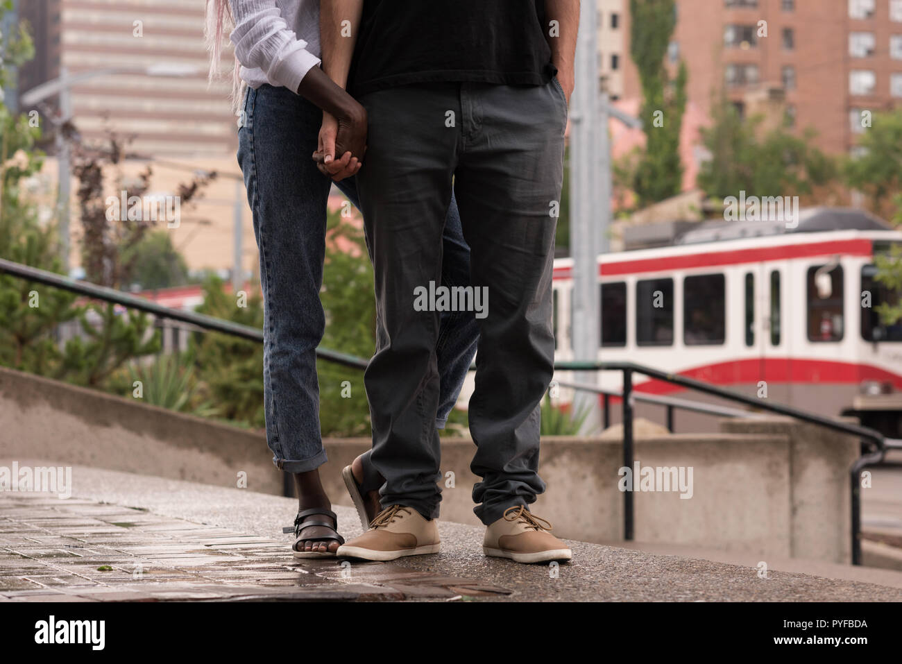 Woman standing on pavement hi-res stock photography and images - Alamy