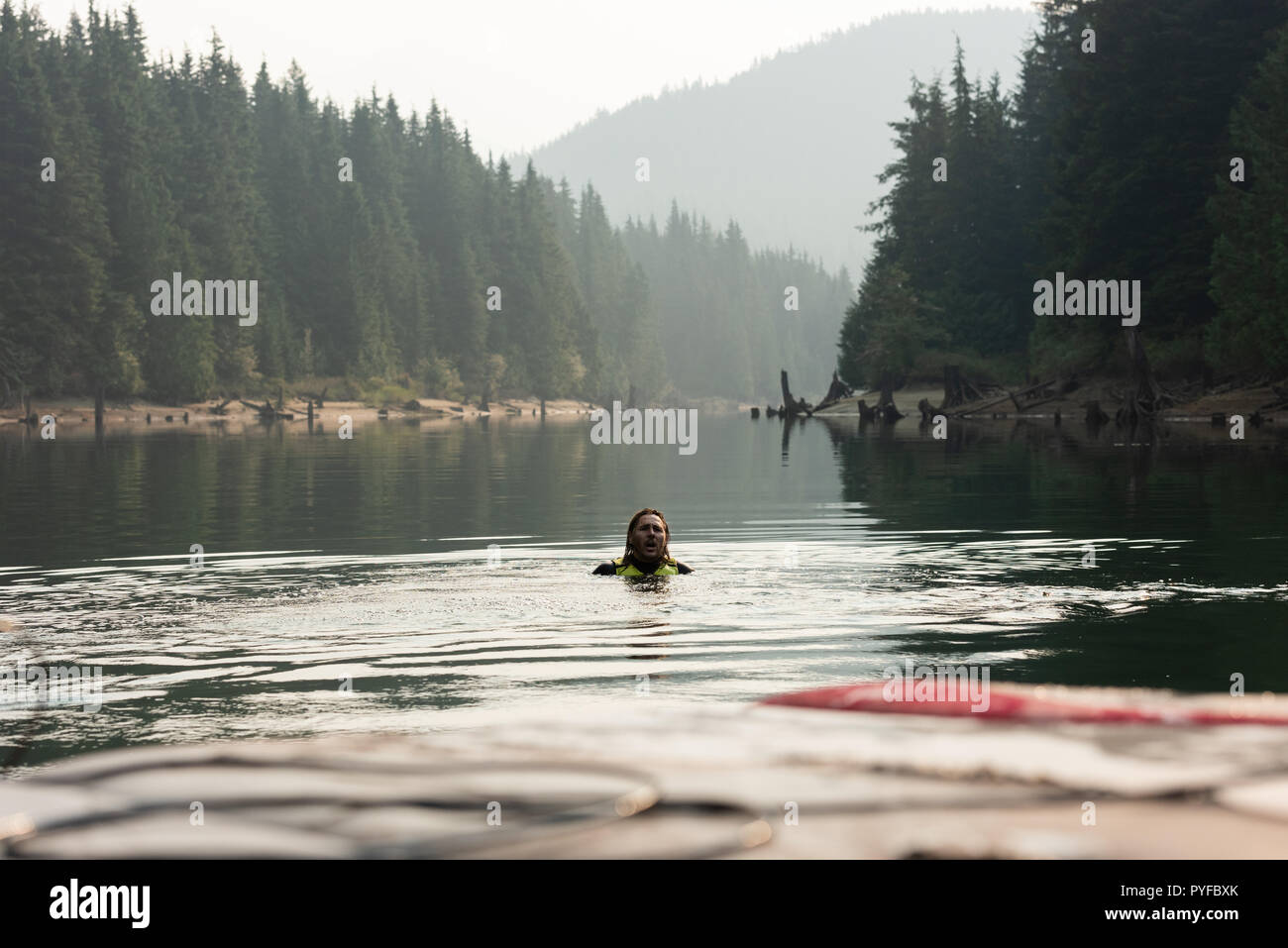 Man swimming in the river Stock Photo - Alamy