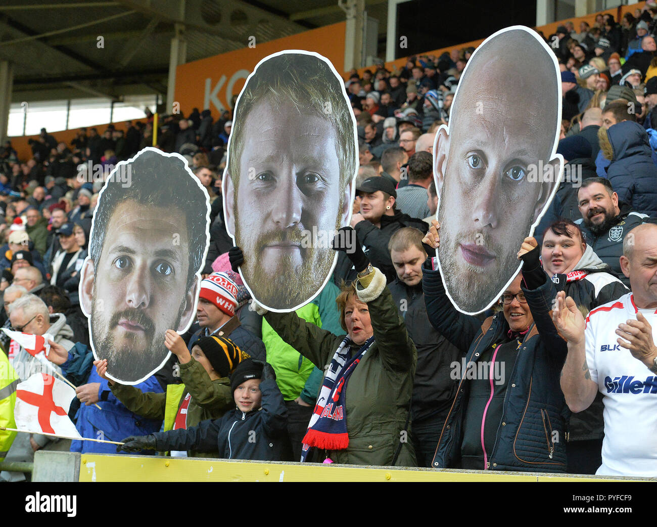 Giant player faces are held aloft by fans as England win the first game ...