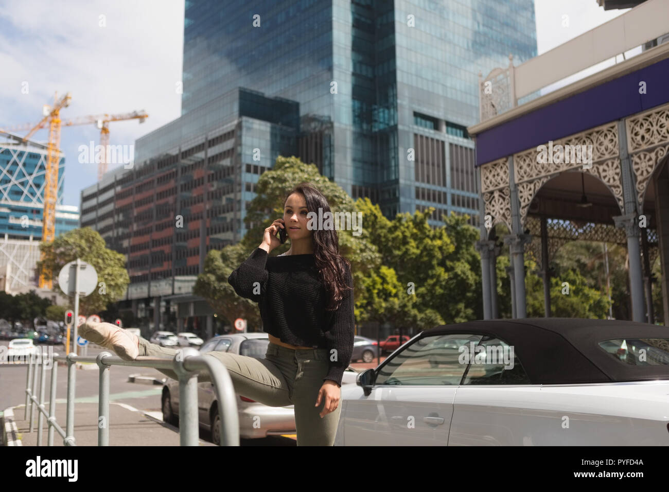 Urban dancer talking on mobile phone while practicing dance Stock Photo ...