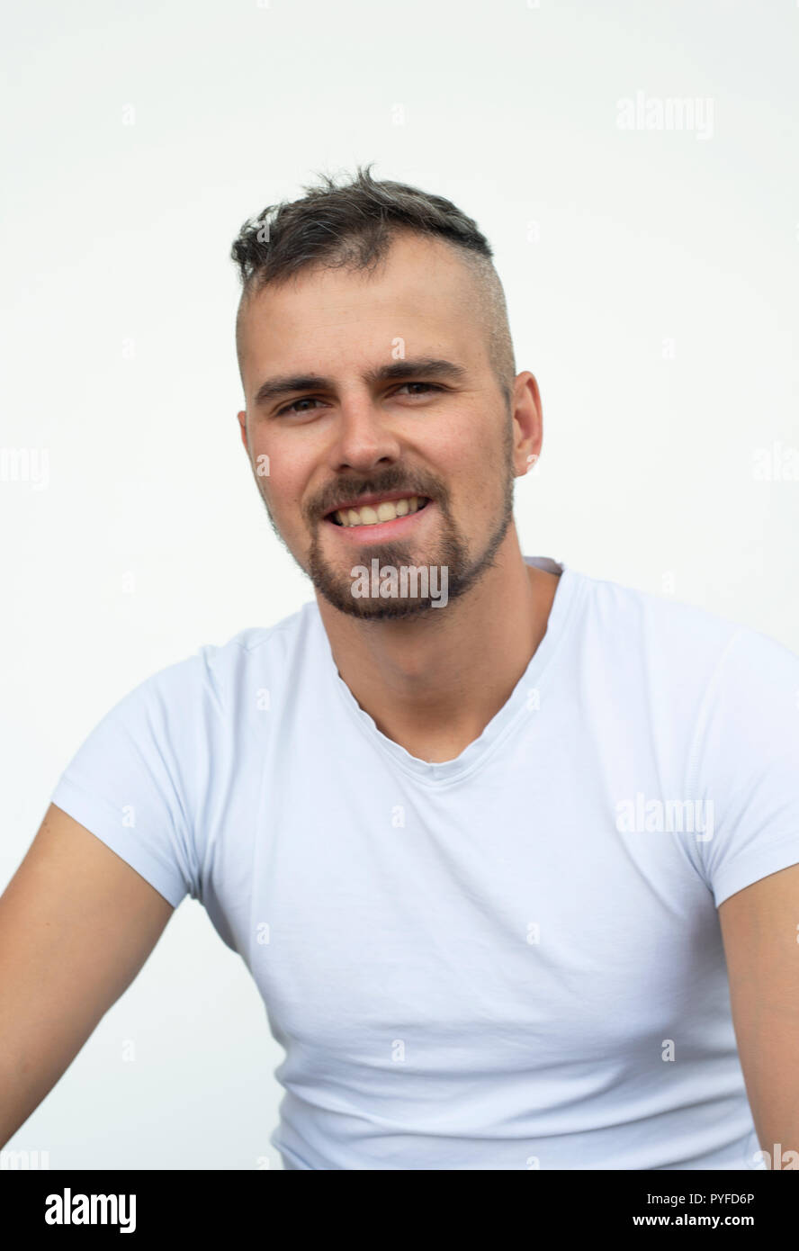 Guy smiling on white background Stock Photo - Alamy