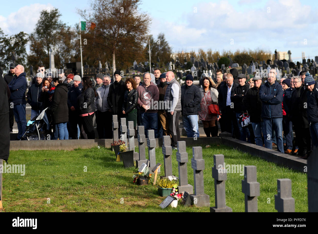 People attend a controversial commemoration at Milltown Cemetery in ...