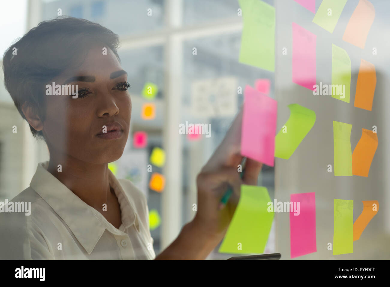 Business executive working on sticky notes Stock Photo - Alamy