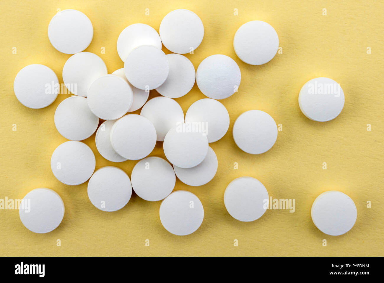 Pharmaceutical tablets yellow white hi-res stock photography and images ...
