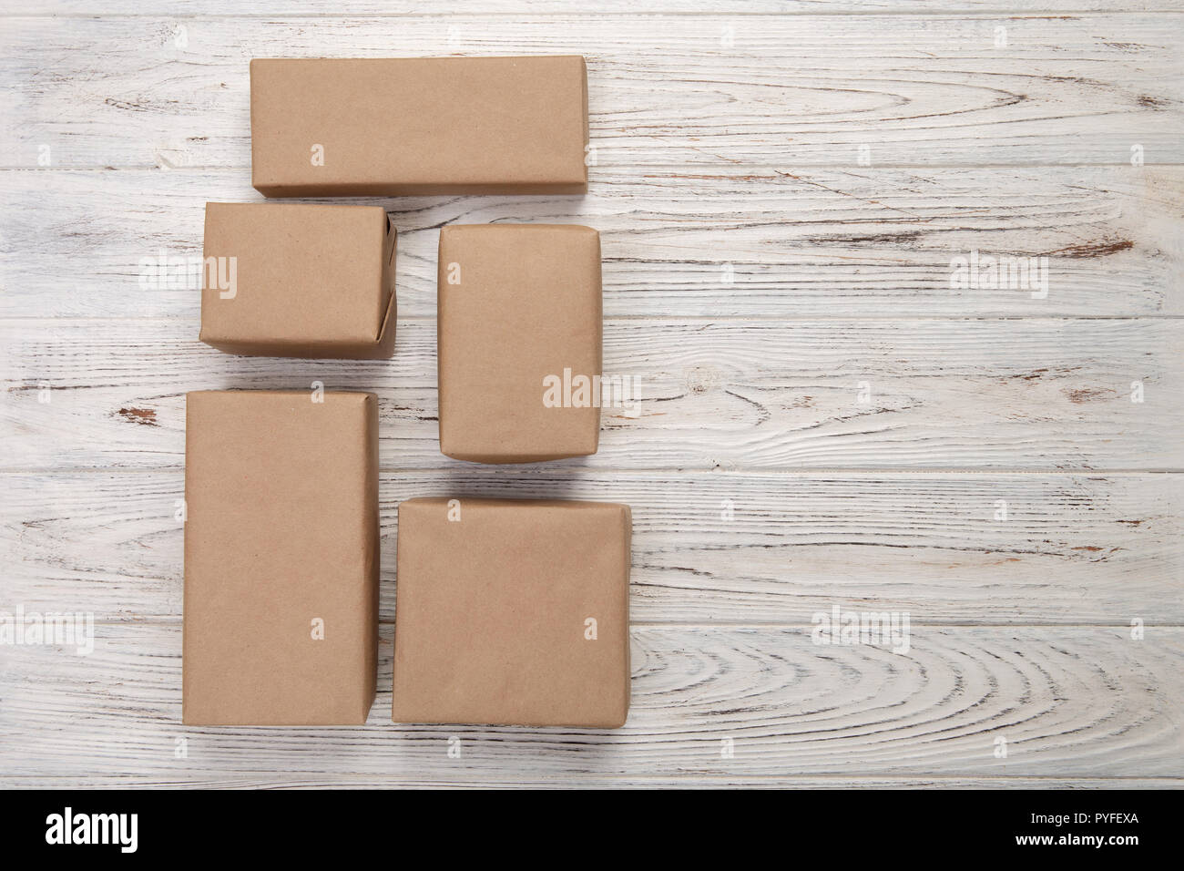 cardboard box on white wooden background, Brown mail package top view ...