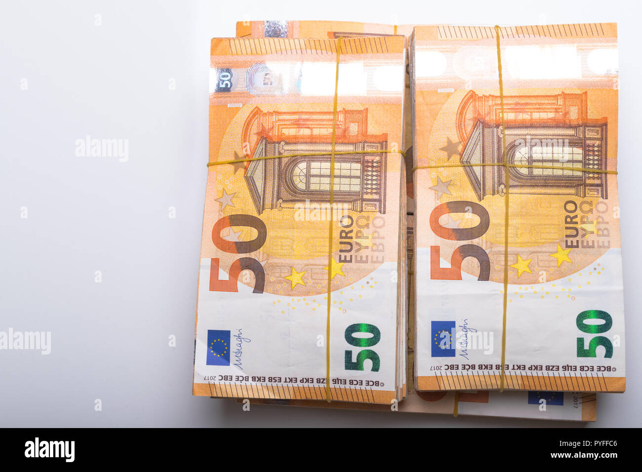 Pile of 50 real euro notes 50-euro banknotes under rubber band ...