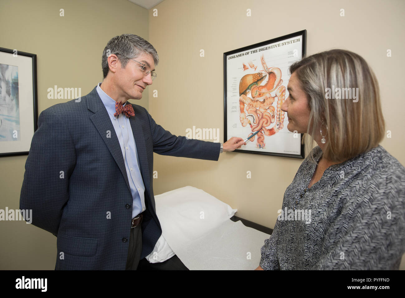Doctor with patient in exam room Stock Photo - Alamy
