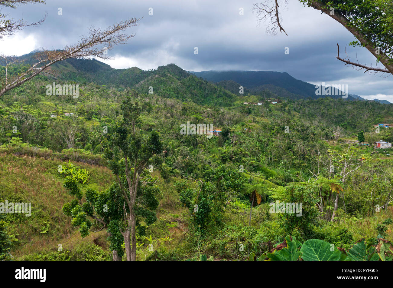 isolated houses in wooded hills and valley surrounded by mountains of ...