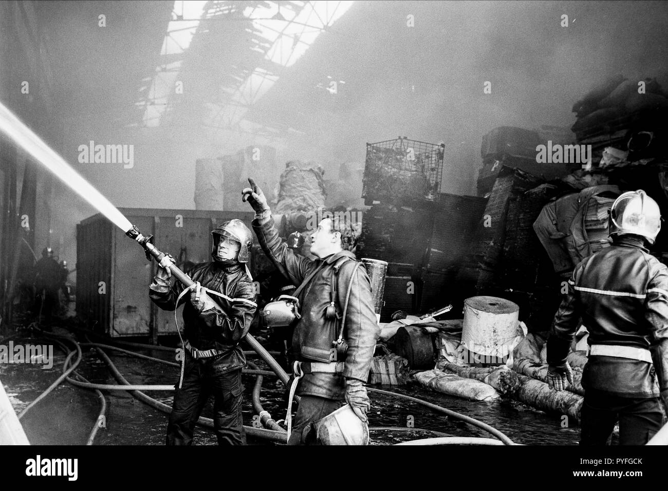 Archives 90ies: Firefighters fight fire in a fabric, Lyon, France Stock ...