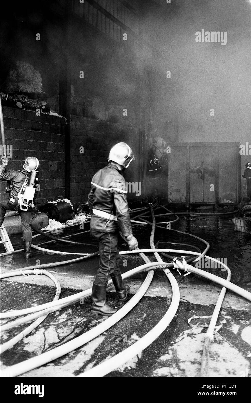 Archives 90ies: Firefighters fight fire in a fabric, Lyon, France Stock ...