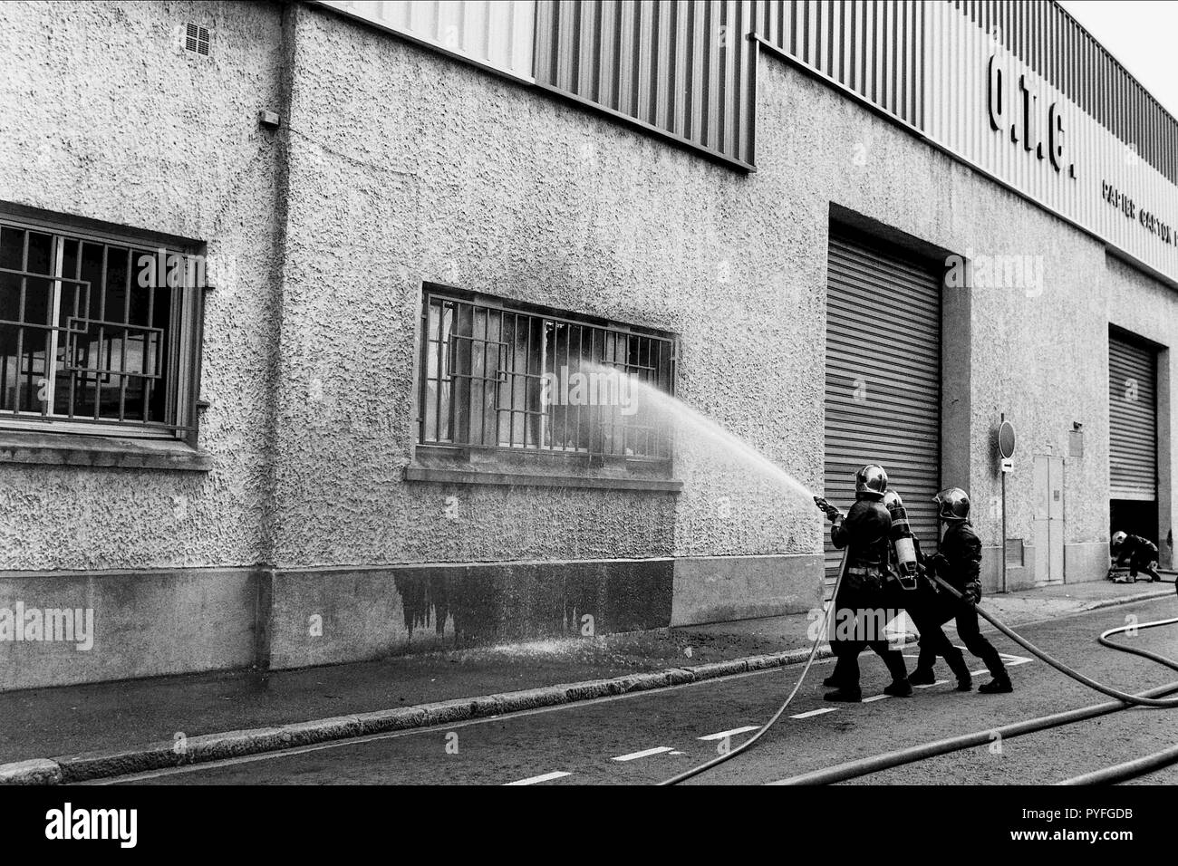 Archives 90ies: Firefighters fight fire in a fabric, Lyon, France Stock ...