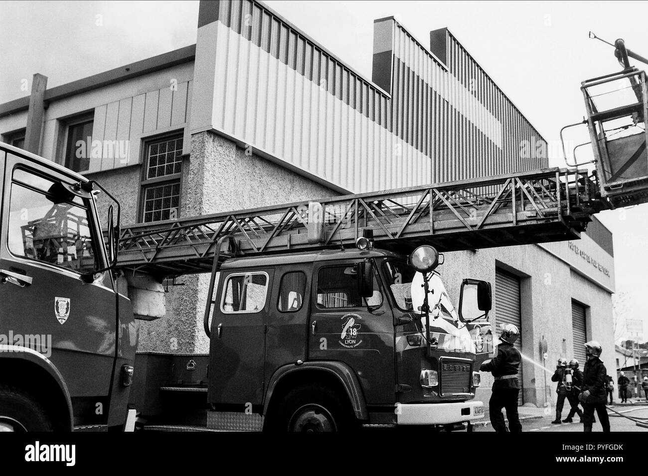 Archives 90ies: Firefighters fight fire in a fabric, Lyon, France Stock ...
