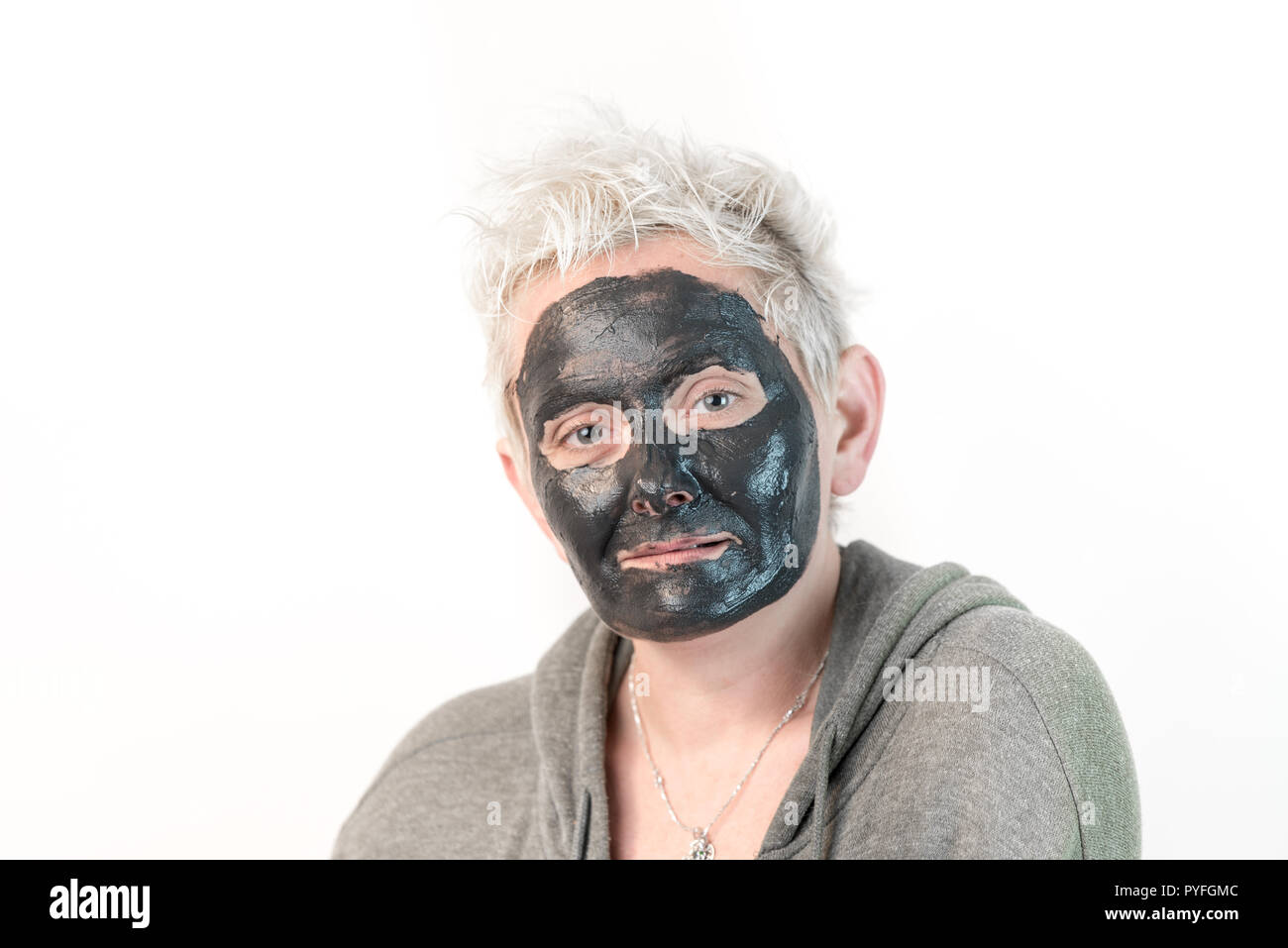 show pure emotions - face of a woman with a black mask showing ...