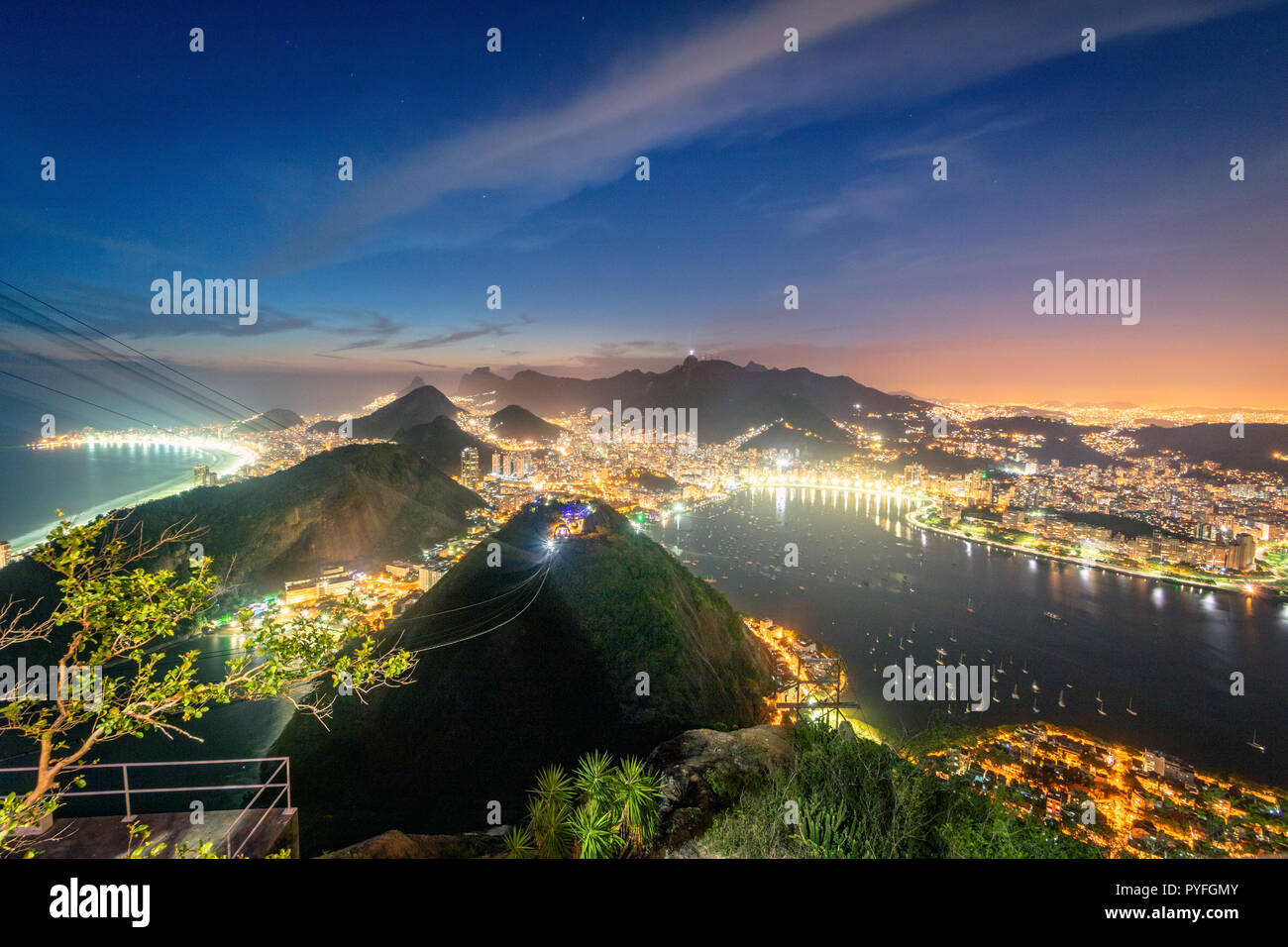 Aerial view of Rio de Janeiro at night with Urca and Corcovado mountain ...